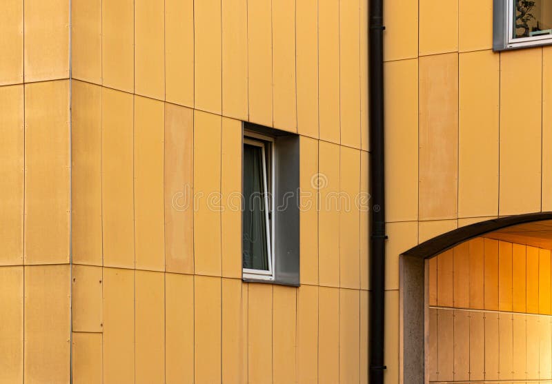 Tall Modern Yellow Building with a Window and Archway Stock Photo ...