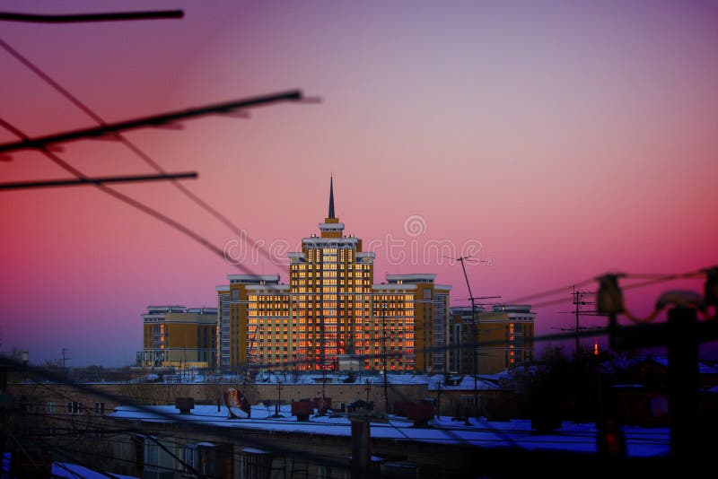 A Tall Multi-storey House Stands in the Rays of the Setting Sun ...