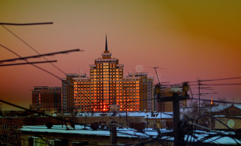 A Tall Multi-storey House Stands in the Rays of the Setting Sun Stock ...