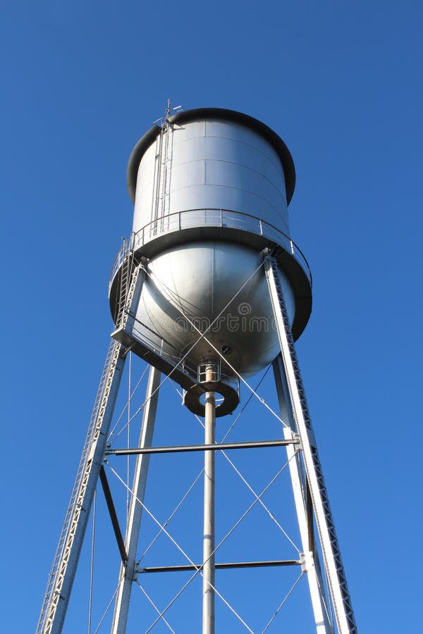 Tall Old Style Water Tower Against a Deep Blue Sky Stock Photo - Image ...