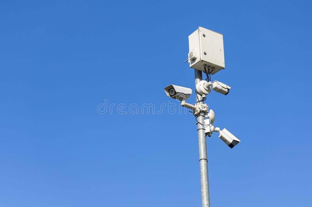 A Tall Pole with Three Security Cameras Stock Photo - Image of ...