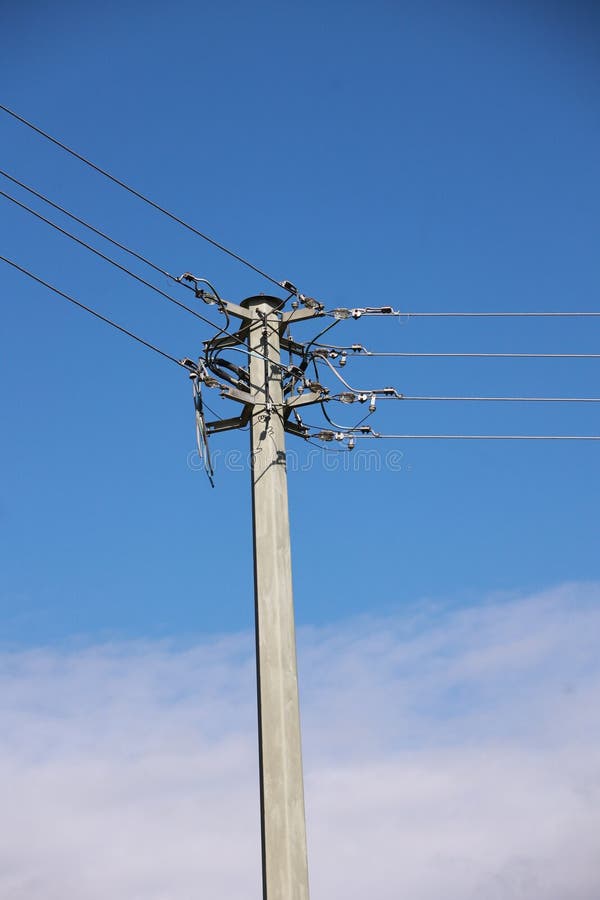 Tall Pole with Wires on it is Standing in a Blue Sky Stock Photo ...