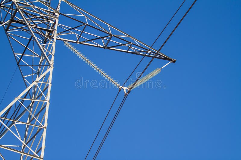 A Tall Power Line Tower with a Blue Sky in the Background Stock Image ...