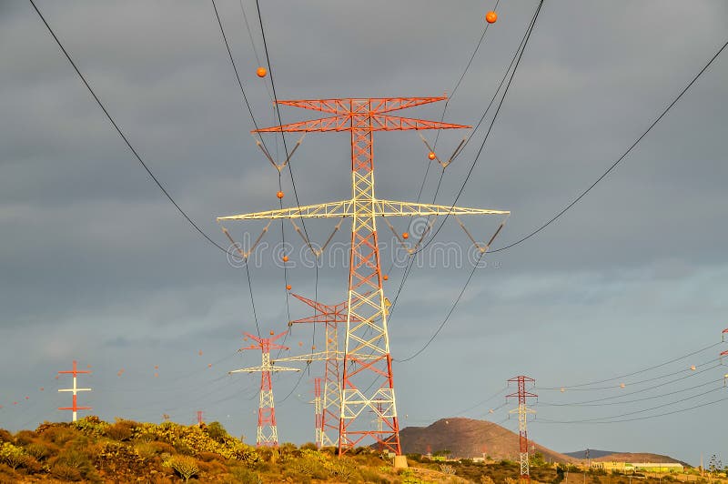 A Tall Power Line Tower with Orange and White Wires Stock Image - Image ...
