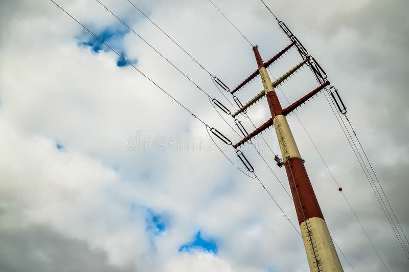 A Tall Power Pole with a Red and White Top Stock Photo - Image of pylon ...