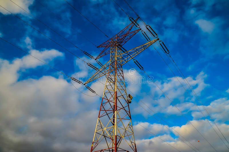 A Tall Power Tower with a Blue Sky in the Background Stock Photo ...