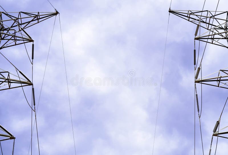 Two Tall Power Towers with a Blue Sky in the Background Stock Photo ...