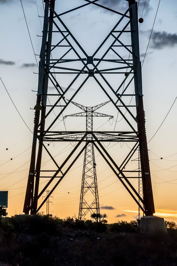 A Tall Power Tower with a Cross on Top Stock Image - Image of ...