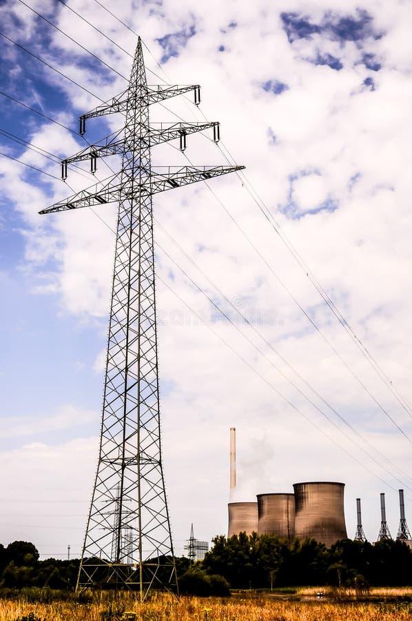 A Tall Power Tower is Surrounded by a Field Stock Photo - Image of ...