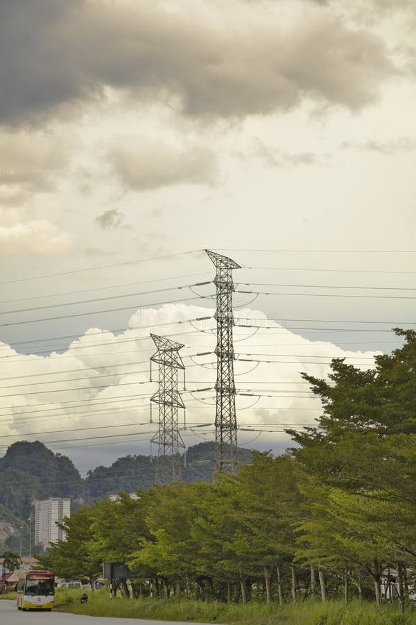 Power Tower with Cables Loom Above Lush Greenery in Suburban of Kuala ...