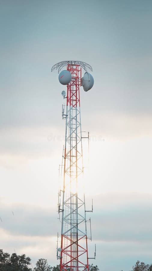 Tall Radio Tower with the Sun Setting in the Background Stock Photo ...