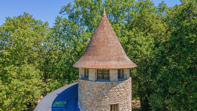 Tall, Rectangular Tower Situated Amongst a Backdrop of Lush Greenery ...