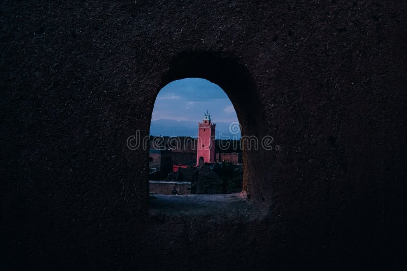 Tall Red Building Shot from an Arched Type Hole in the Wall Stock Image ...