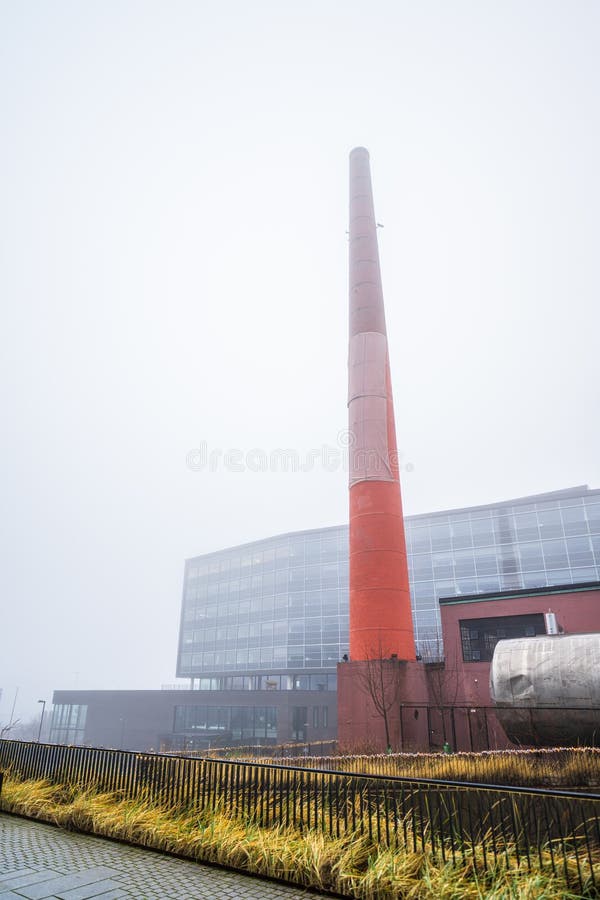 Tall Red Chimney in Front of a Modern Office Building.. Stock Image ...