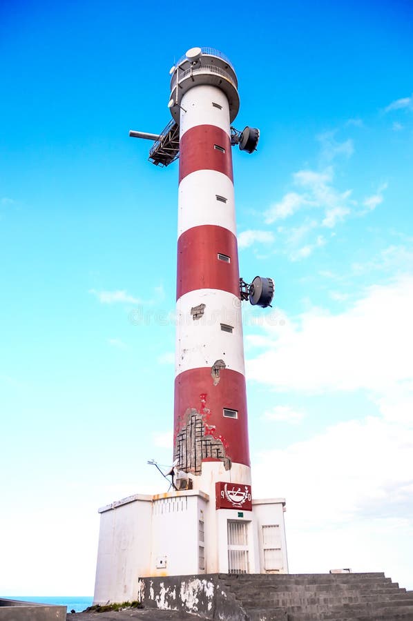 A Tall Red and White Lighthouse with a White Roof Stock Photo - Image ...