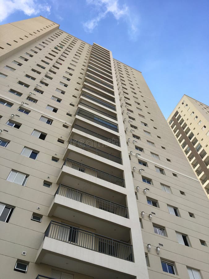 Tall residential building stock image. Image of facade - 193556233