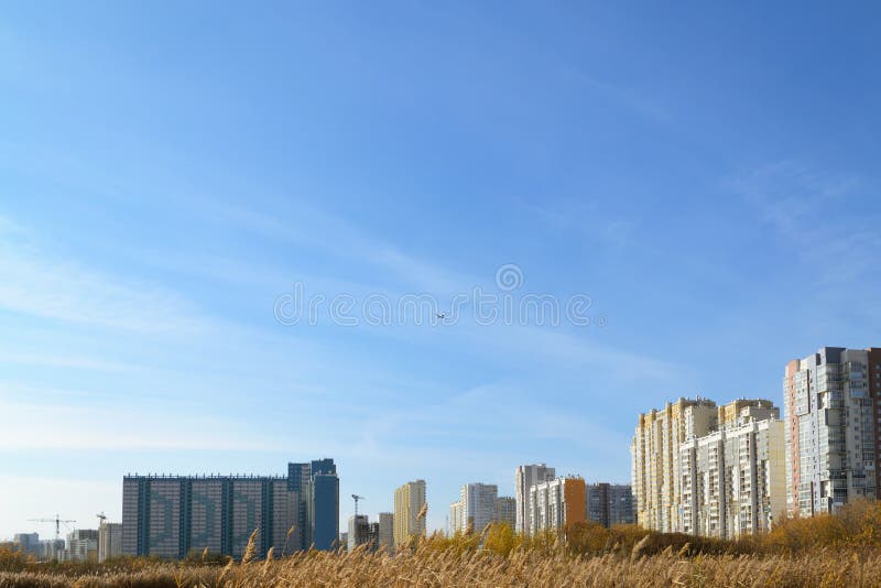 Tall Residential Panel Buildings and an Airplane in the Blue Sky Stock ...