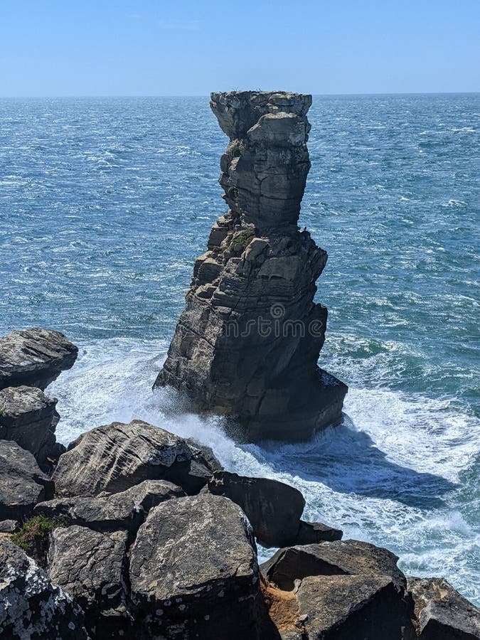 Tall Rock Structure in the Middle of the Ocean Stock Photo - Image of ...