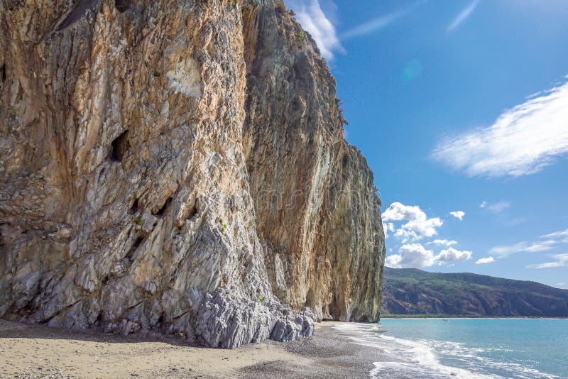 Tall Sharp Cliff Shooted from the Water on the Beach Stock Photo ...