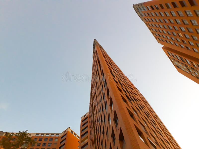 Tall, Sharp Homes, Challenging Brick Buildings with Blue Sky Stock ...