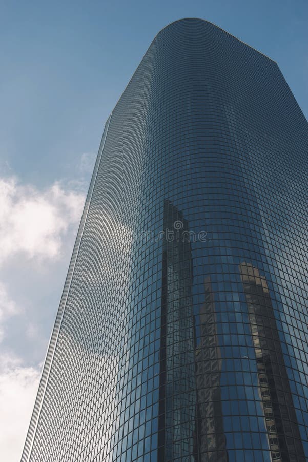 Off Center Skyscraper with Blue Sky and Clouds Stock Photo - Image of ...