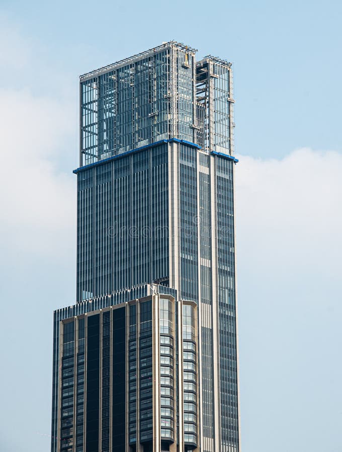 A Very Tall Skyscraper Near a Cloudy Sky on the Beach Stock Image ...