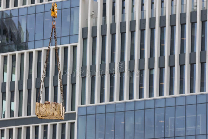 Skyscraper Windows with Reflection and Construction Crane Stock Photo ...