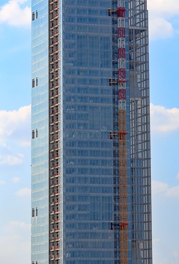Tall Skyscraper Under Construction Made of Glass and Steel with Stock ...