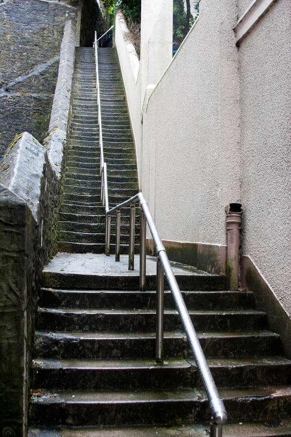 Tall Slippery Wet Stone Steps with Steel Rail Stock Image - Image of ...
