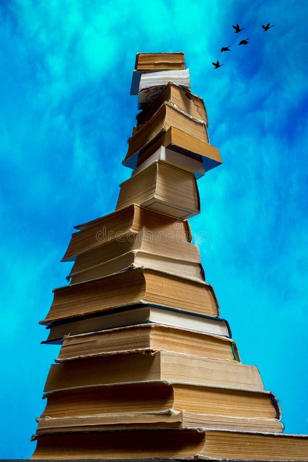 A Tall Stack of Books Going To Heaven Stock Photo - Image of folded ...