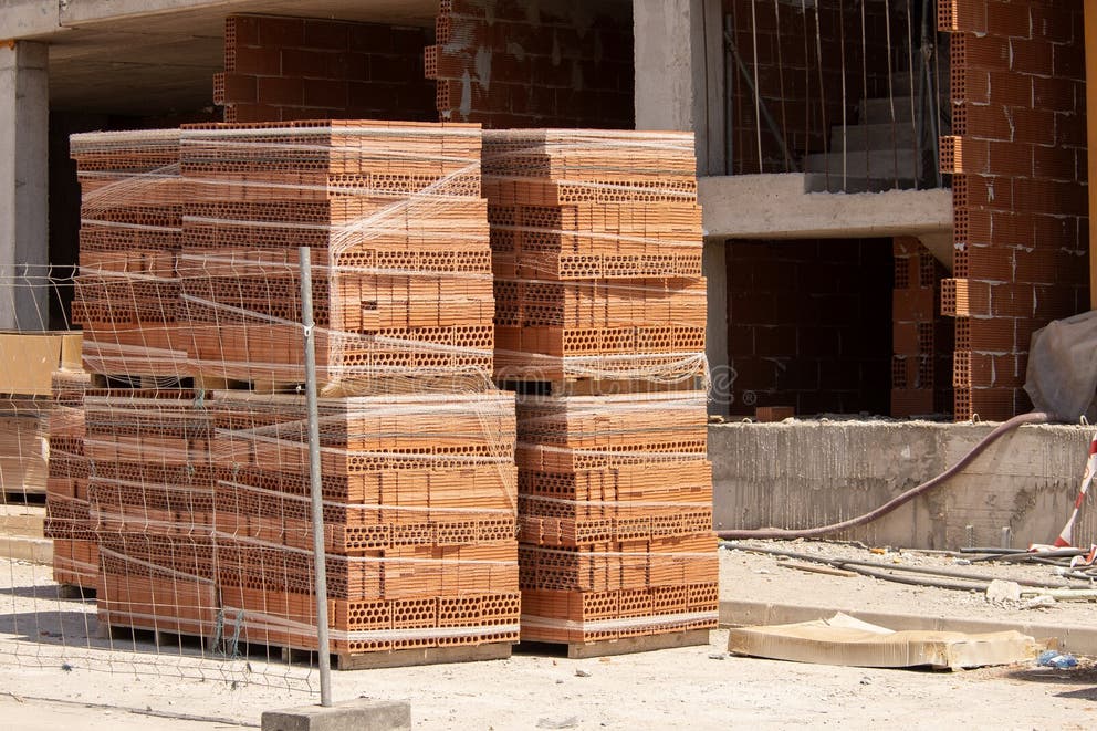 A Tall Stack of Bricks Packed on a Pallet at a Construction Site Stock ...