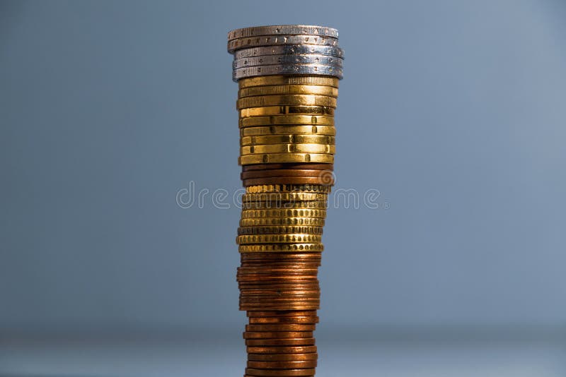 A Tall Stack of Coins. Euro Coins are Piled Up, the Largest Coins are ...