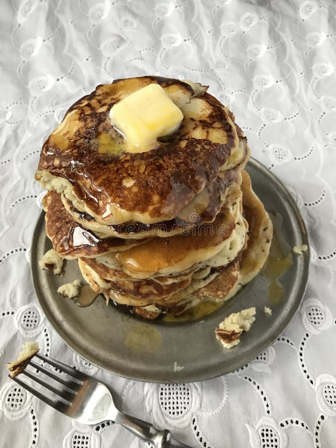 Tall Stack of Hotcakes with Melted Butter and Syrup on White Linen ...