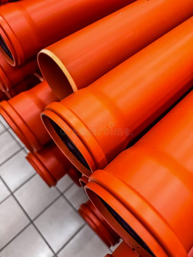 Tall Stack of Long Orange Construction Pipes in Store, Aligned ...