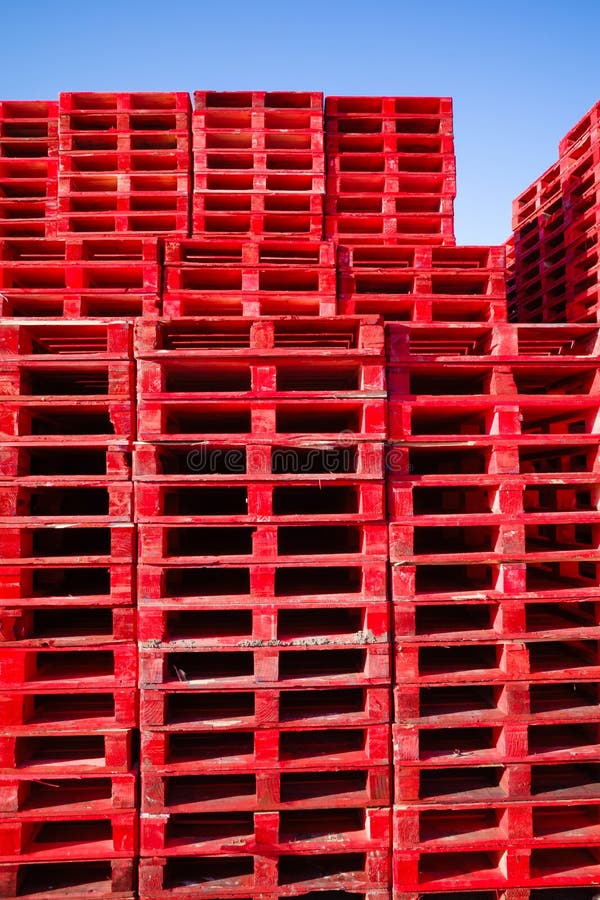 Tall Stack of Red Wooden Pallets Stock Photo - Image of stacked, pile ...