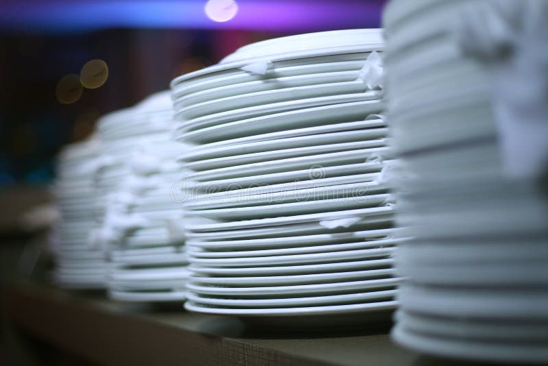 Tall Stack of White Plates on a Table. Stock Image - Image of dish ...