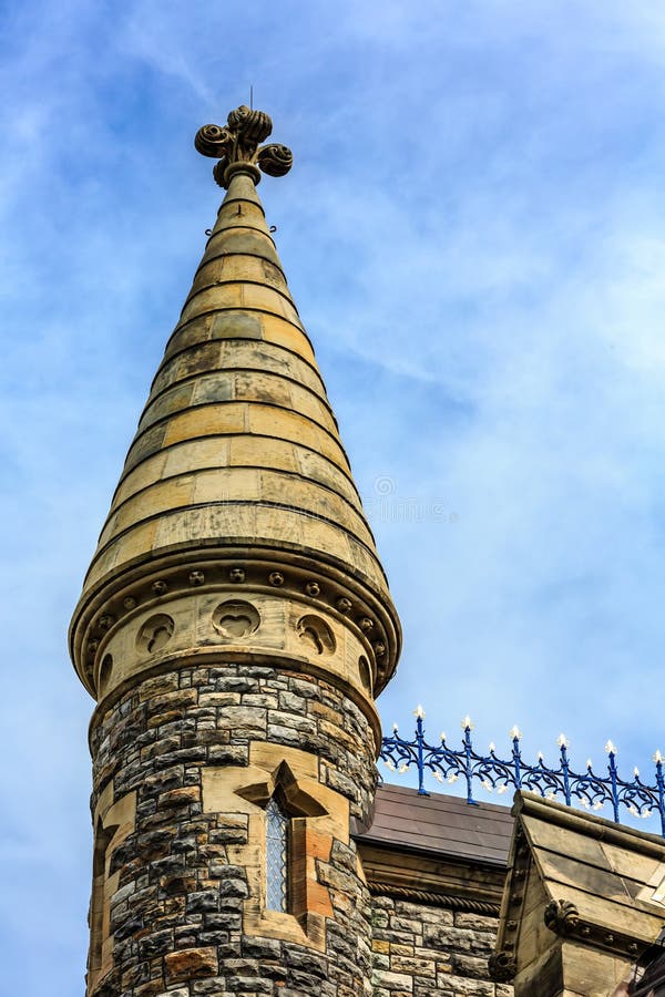 Tall Stone Lighthouse Under a Beautiful Blue Sky with Puffy Clouds ...