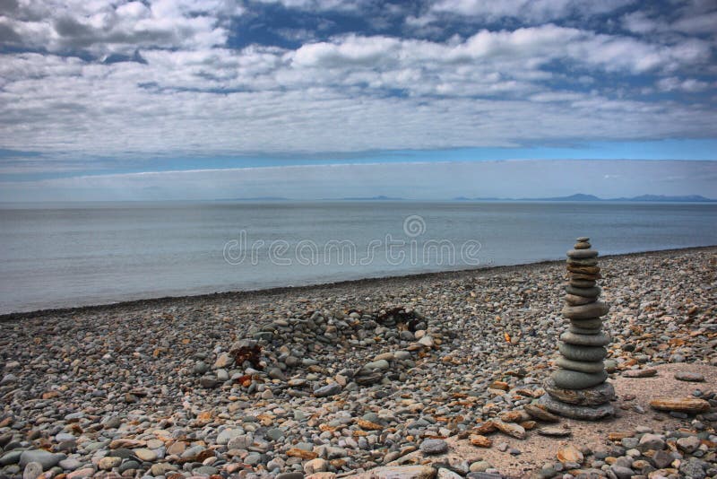 Tall Stones Balancing on Top of Each To Make a Tower on a Beach Stock ...