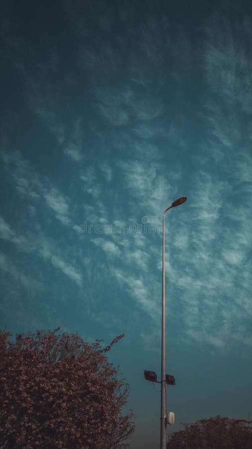 Tall Street Light with a Background of Mesmerizing Cloudscape, Vertical ...