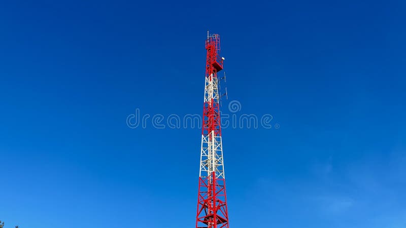 A Telecommunication Tower Standing Tall Against the Clear Blue Sky on a ...