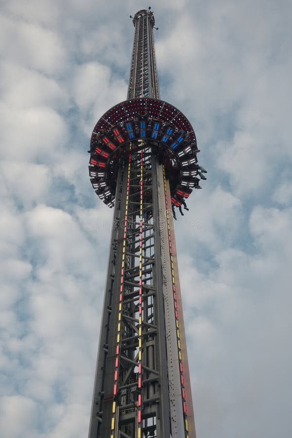 A Tall Tower with a Roller Coaster on Top Stock Image - Image of ...
