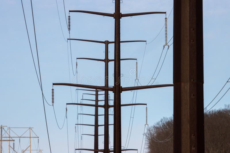 Power Lines and Pylons Against the Blue Sky Stock Photo - Image of ...