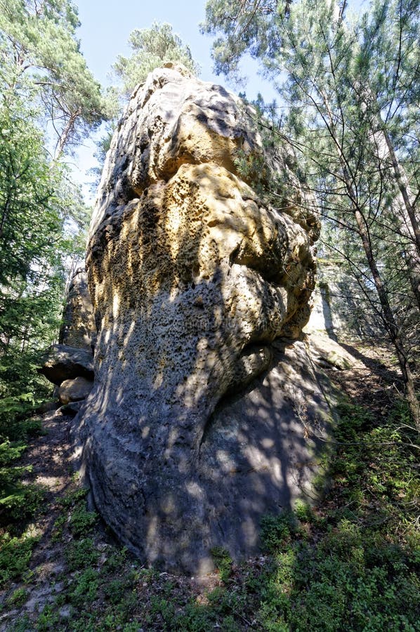 Tall and Unique Rock Formation with Shadows of Trees Falling on it ...