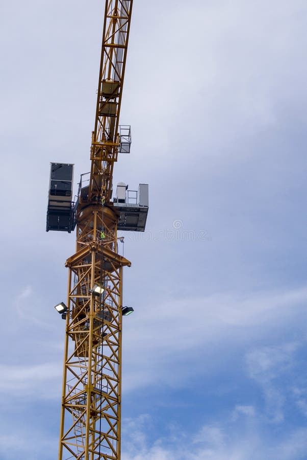 Tall Vertical Construction Crane Against a Blue Sky Stock Photo - Image ...