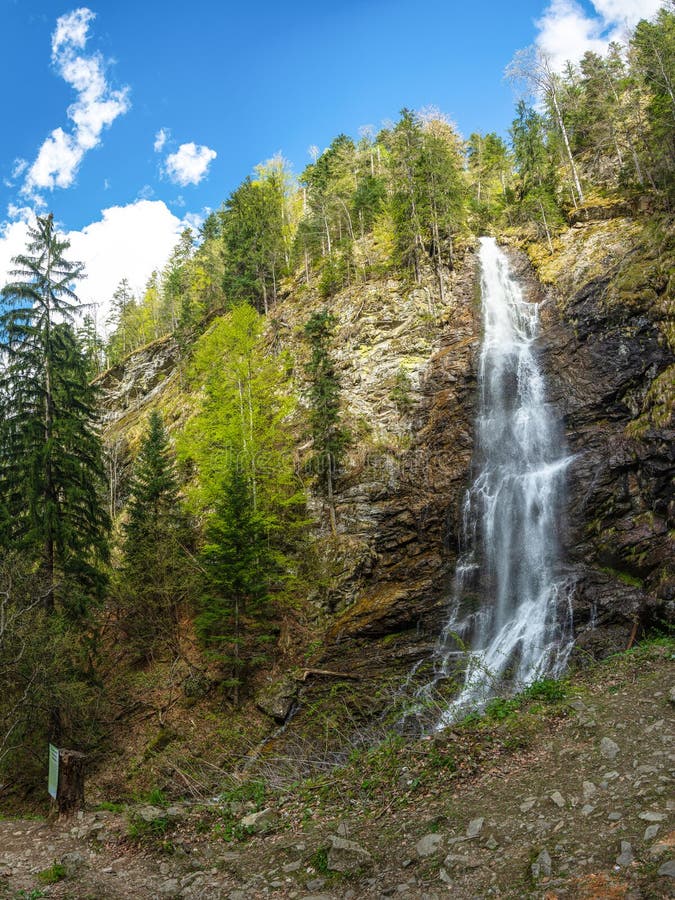 A Tall Waterfall Falling of a Vertical Cliff Stock Image - Image of ...
