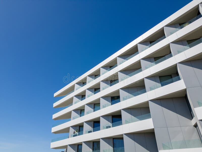 Tall White Building with Lots of Windows Stock Photo - Image of glass ...