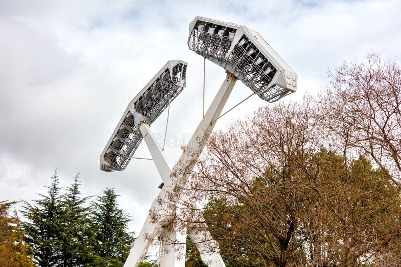 A Tall White Structure with Two Sets of Lights on Top Stock Image ...