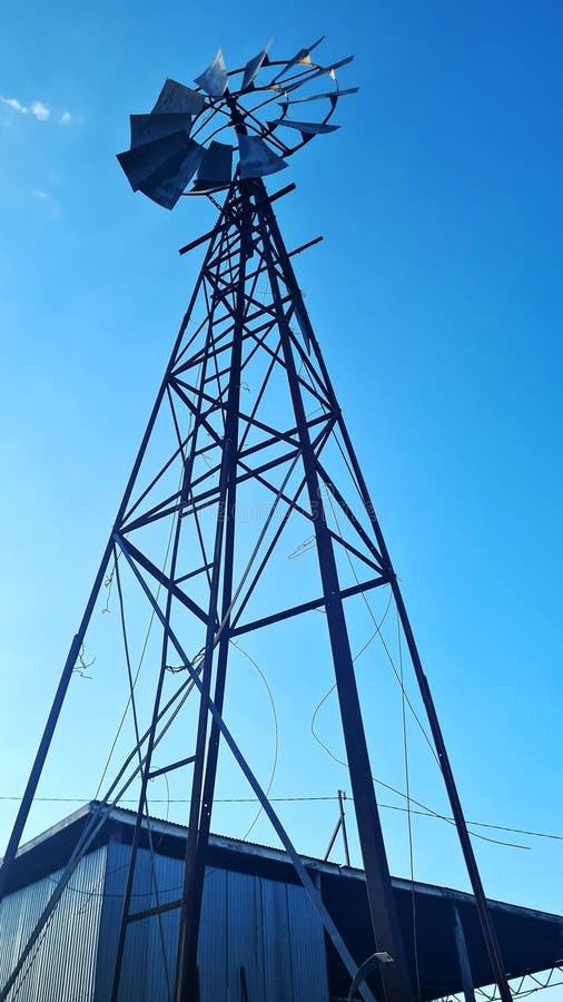 Windmill Against Clear Blue Sky Stock Photo - Image of blue, renewable ...