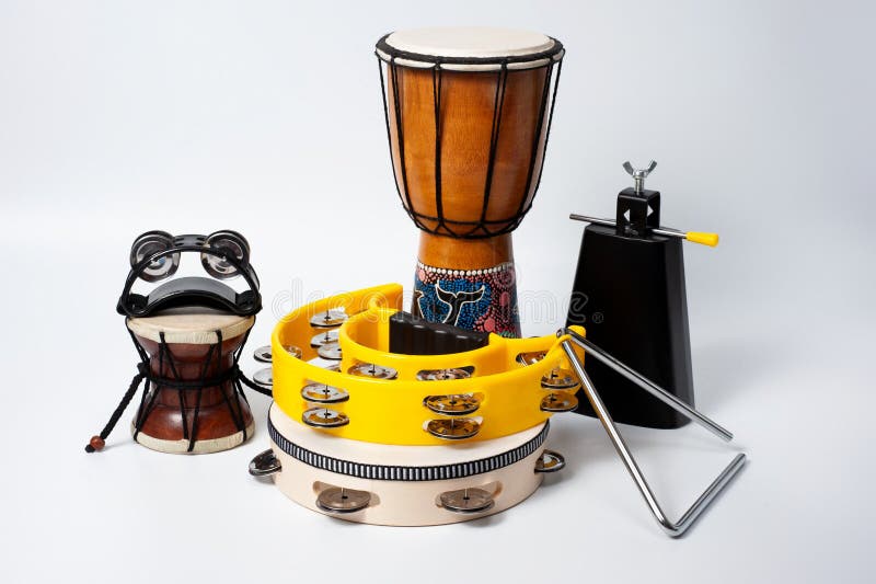 Tambourine and Other Percussion Musical Instruments, Shot on a White ...