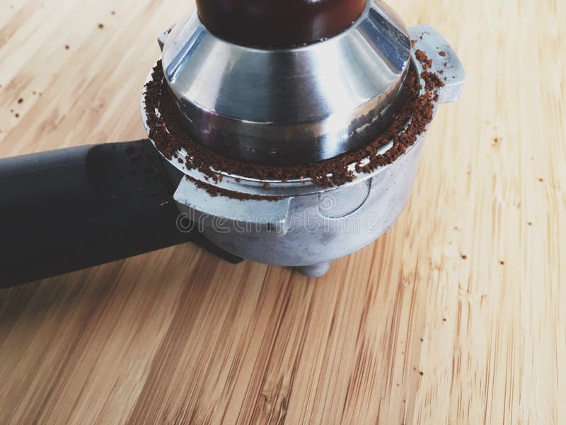 Tampering ground coffee stock image. Image of tampering - 66024341